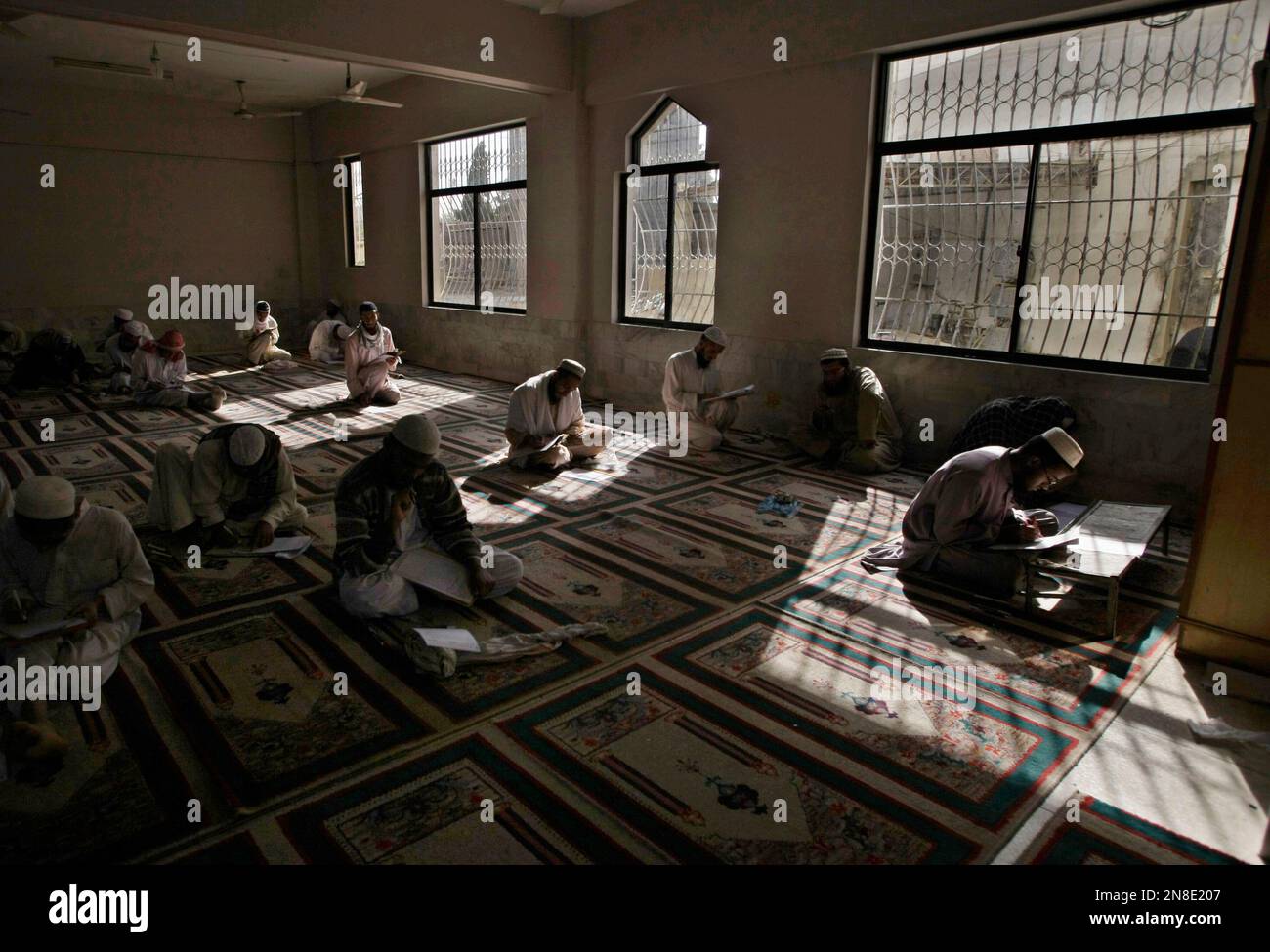 Pakistani and foreign Muslim students take the annual examination at ...