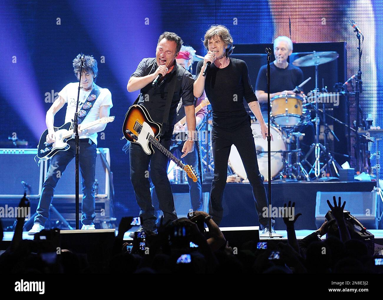 Musician Bruce Springsteen, left, performs with Mick Jagger, Ronnie ...