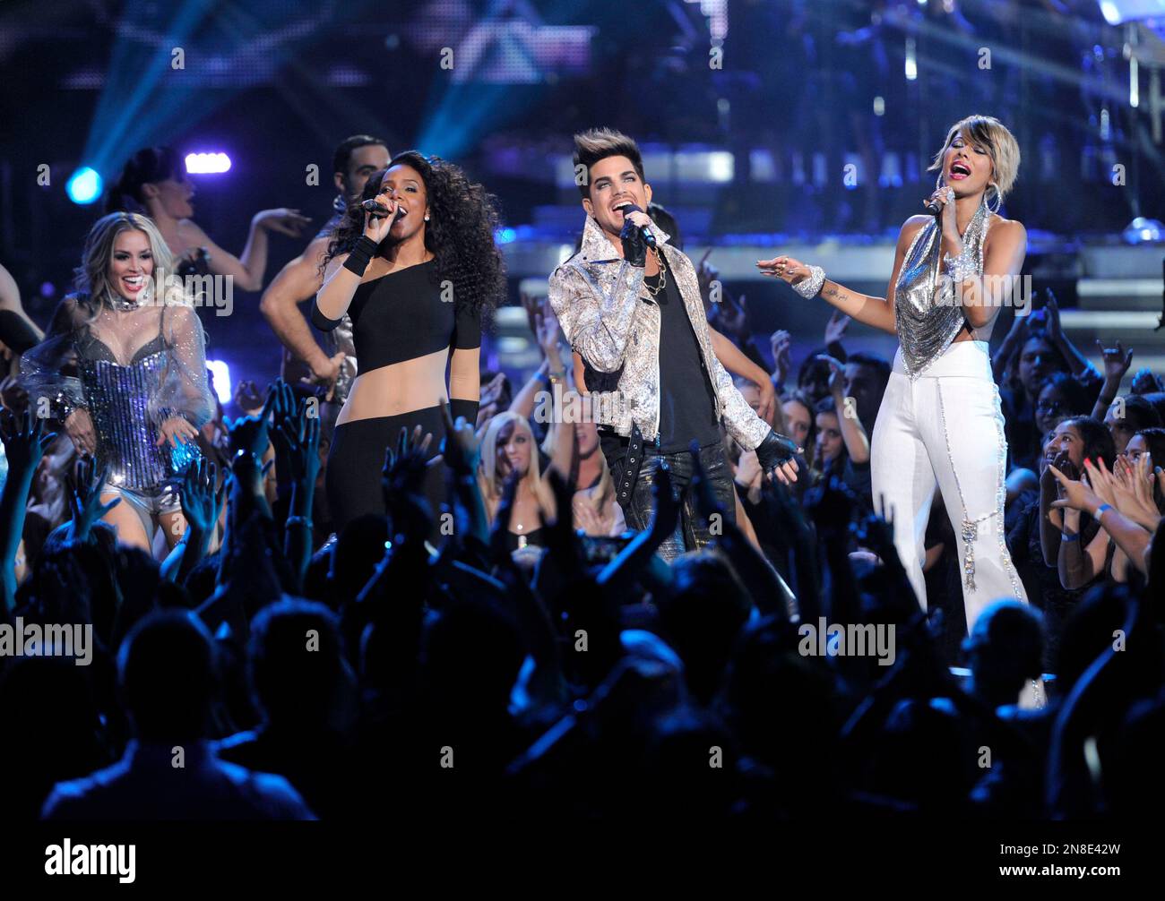Kelly Rowland, left, Adam Lambert, center, and Keri Hilson perform at ...