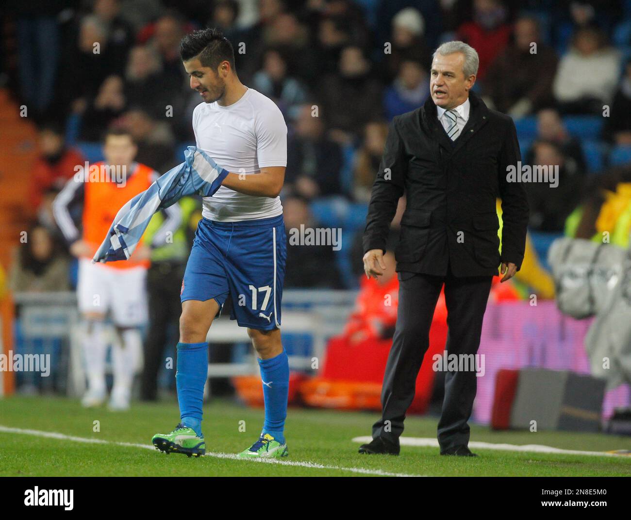 Espanyol's Juan Angel Albin, left, celebrates his goal with coach ...