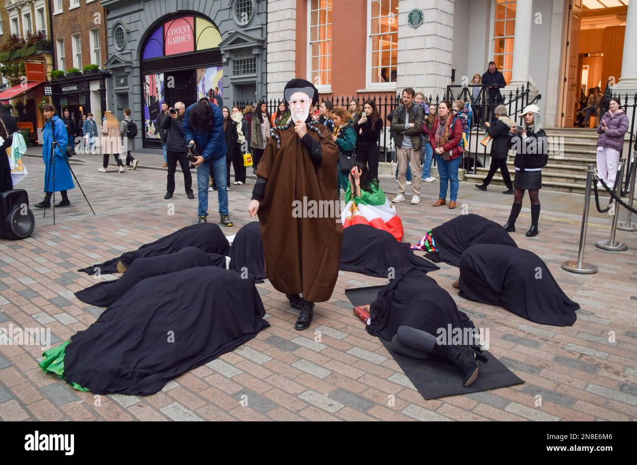 London, UK. 11th Feb, 2023. A protester wearing an Ayatollah Khomeini ...