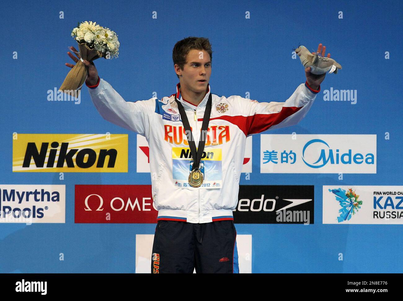 Gold medalist Vladimir Morozov of Russia waves to the fans during men's ...