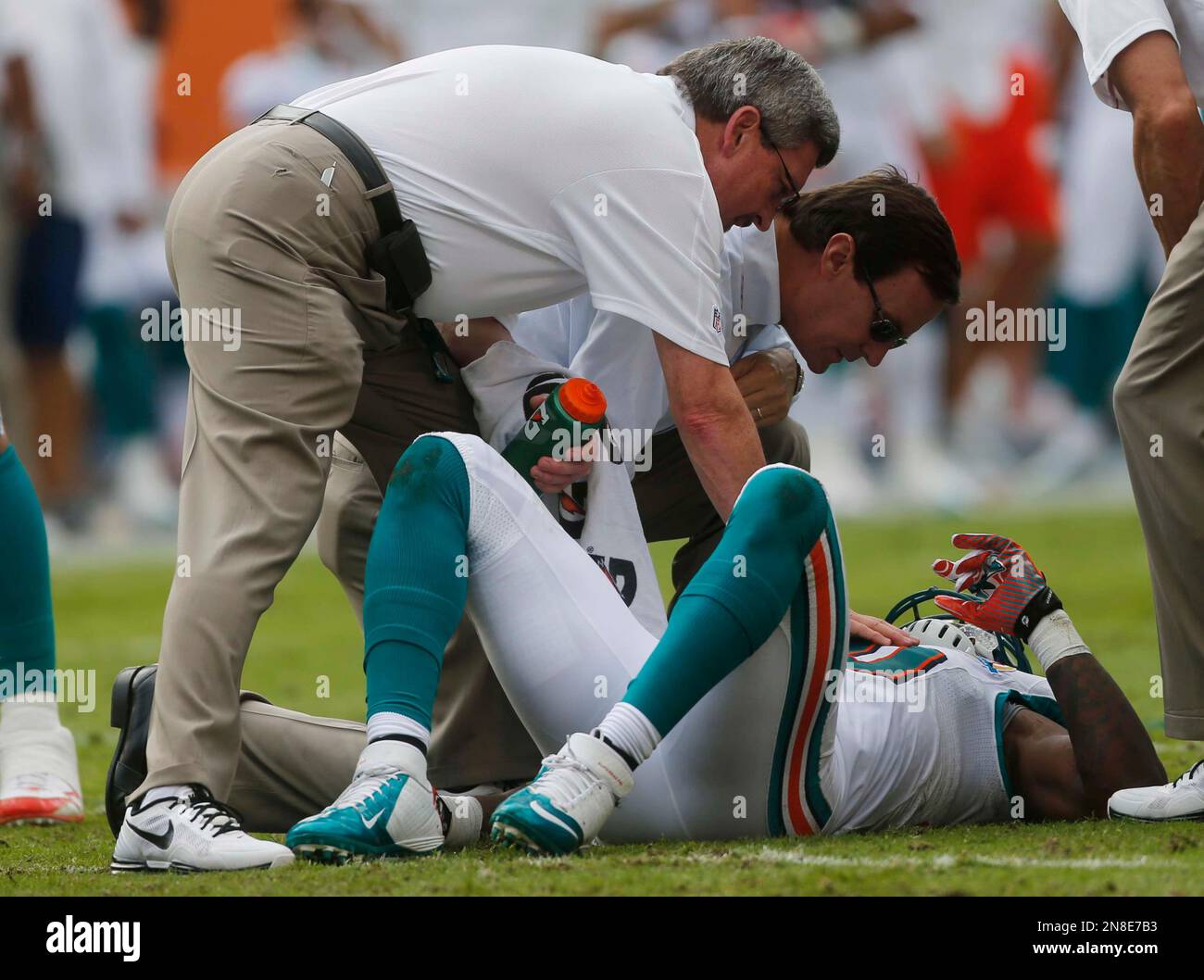 Miami Dolphins strong safety Chris Clemons (30) is attended by team ...
