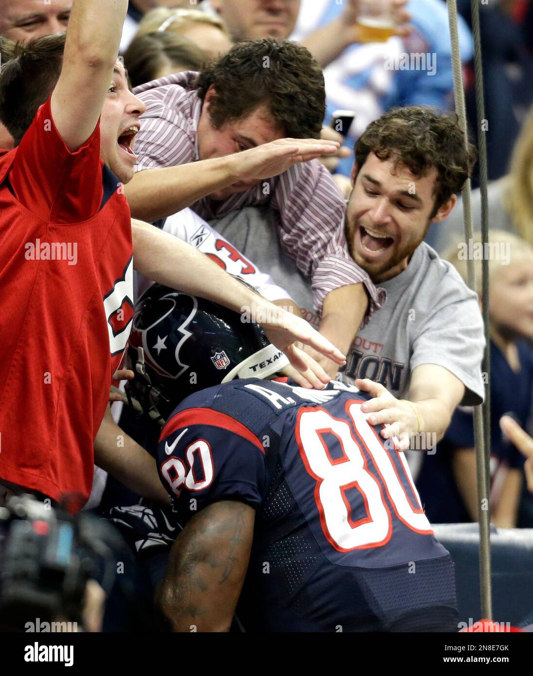 Houston Texans wide receiver Andre Johnson (80) leaps in the stands ...