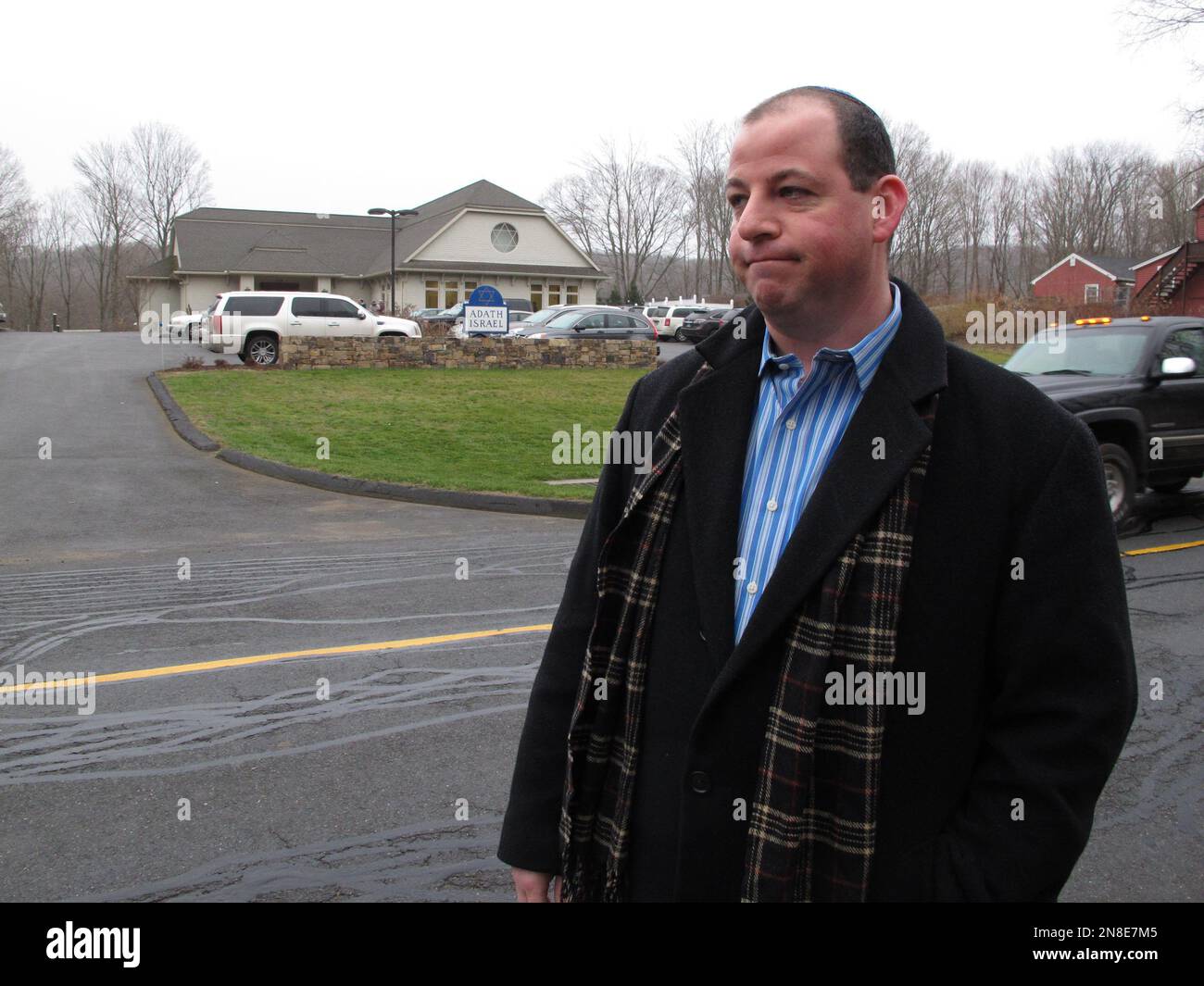 Andrew Paley, president of Congregation Adath Israel, talks to ...