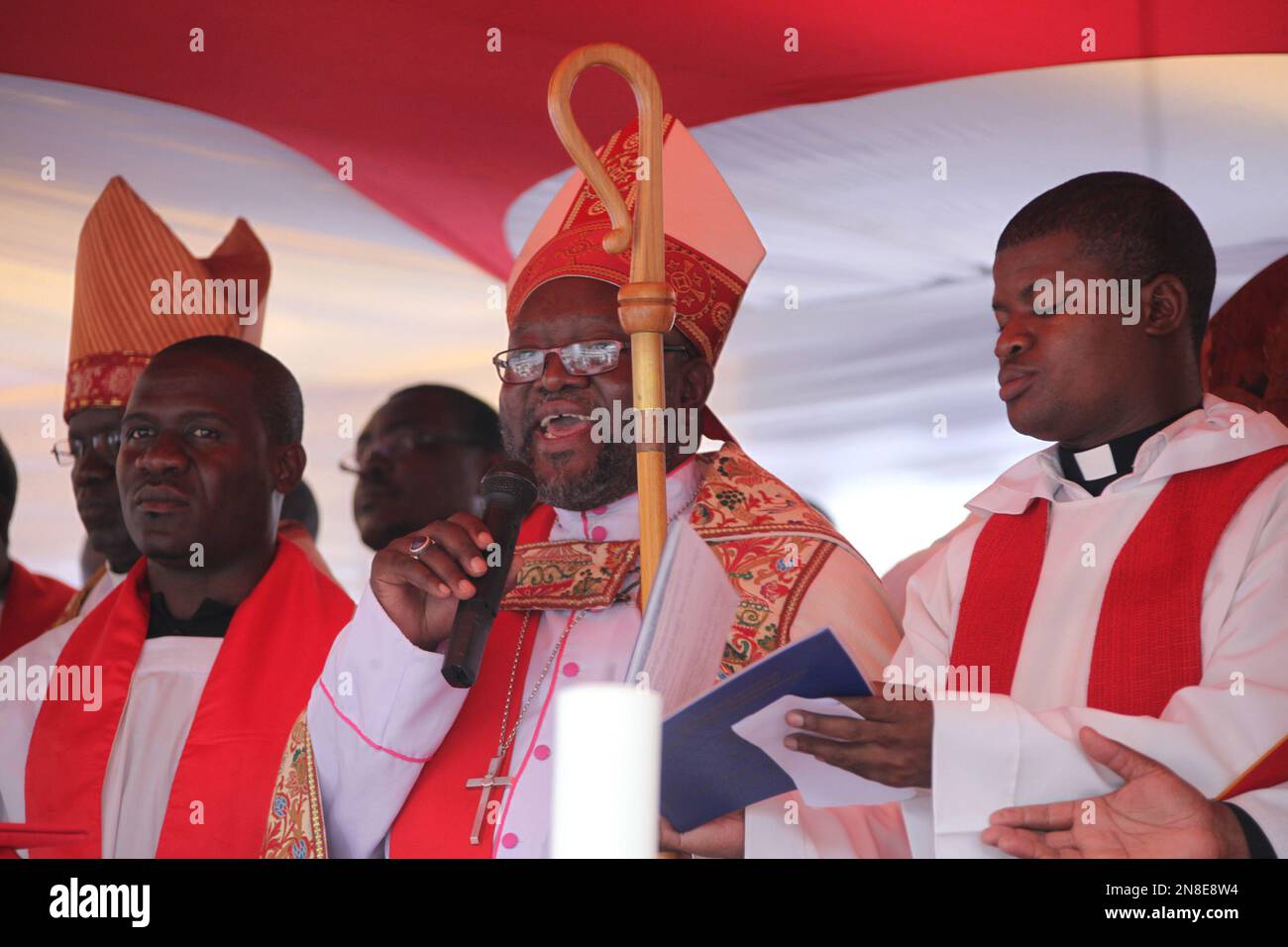 Anglican Bishop of Harare, Chad Gandiya, centre, is seen in Africa ...