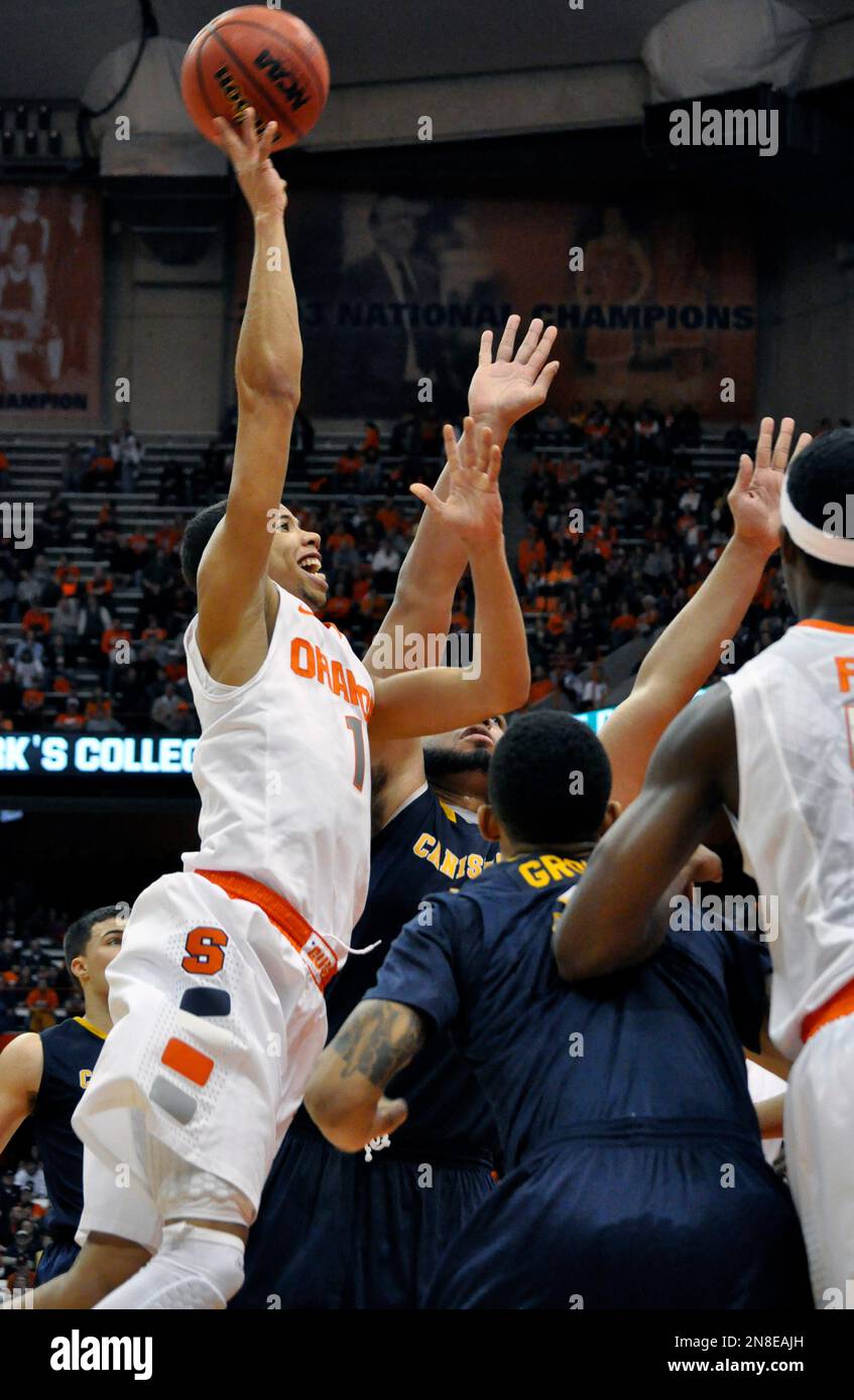 Syracuse's Michael Carter-Williams, left, shoots against Canisius ...