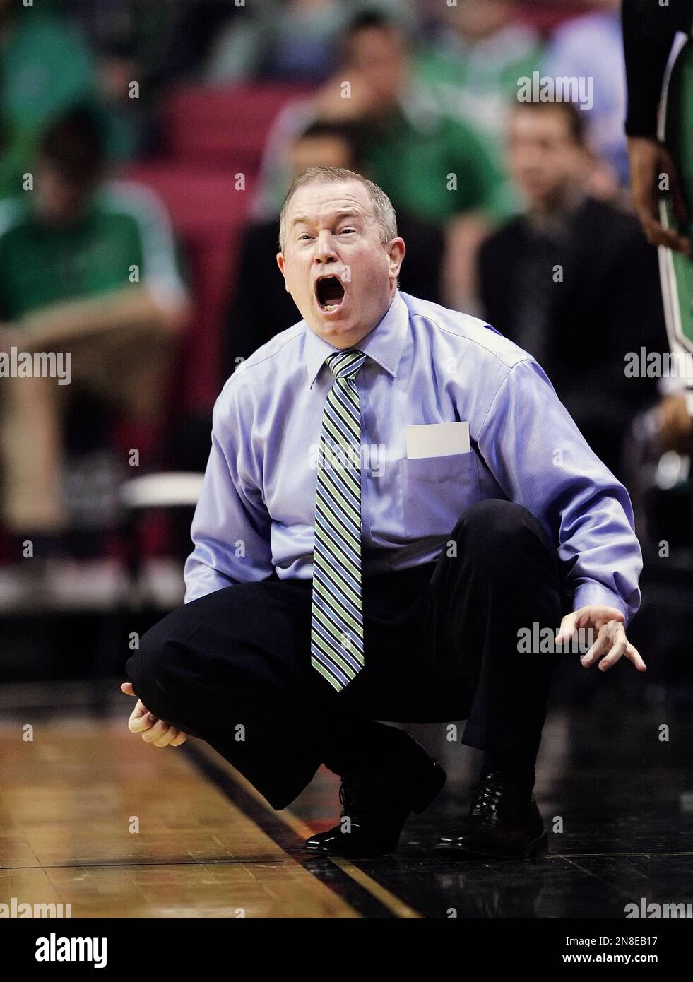 Marshall head coach Tom Herrion yells instructions to his players ...