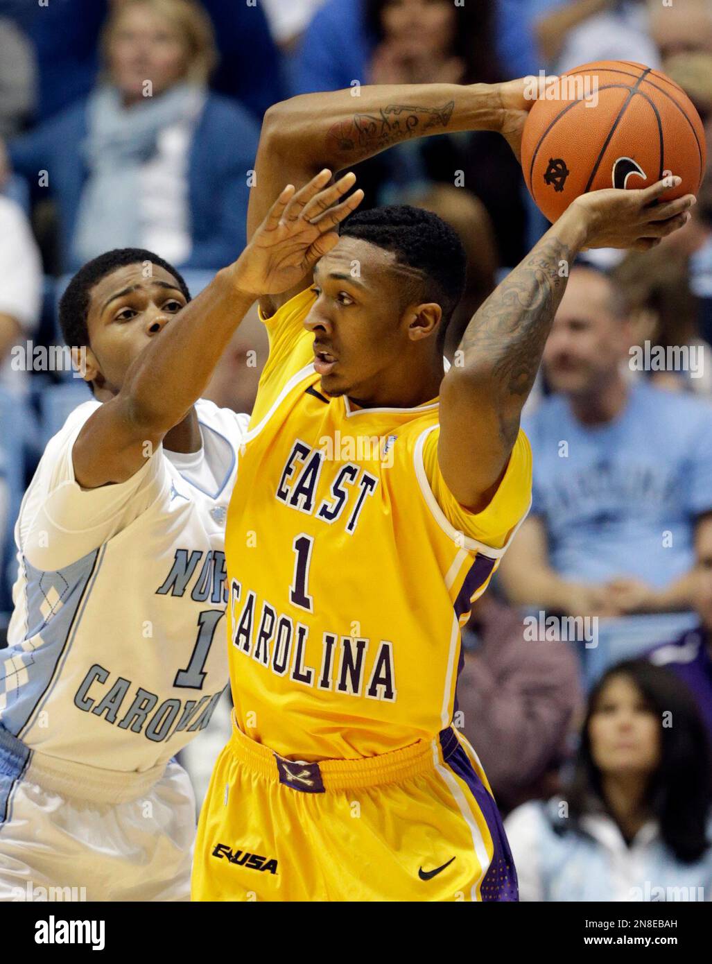 North Carolina's Dexter Strickland, left, pressures East Carolina's ...