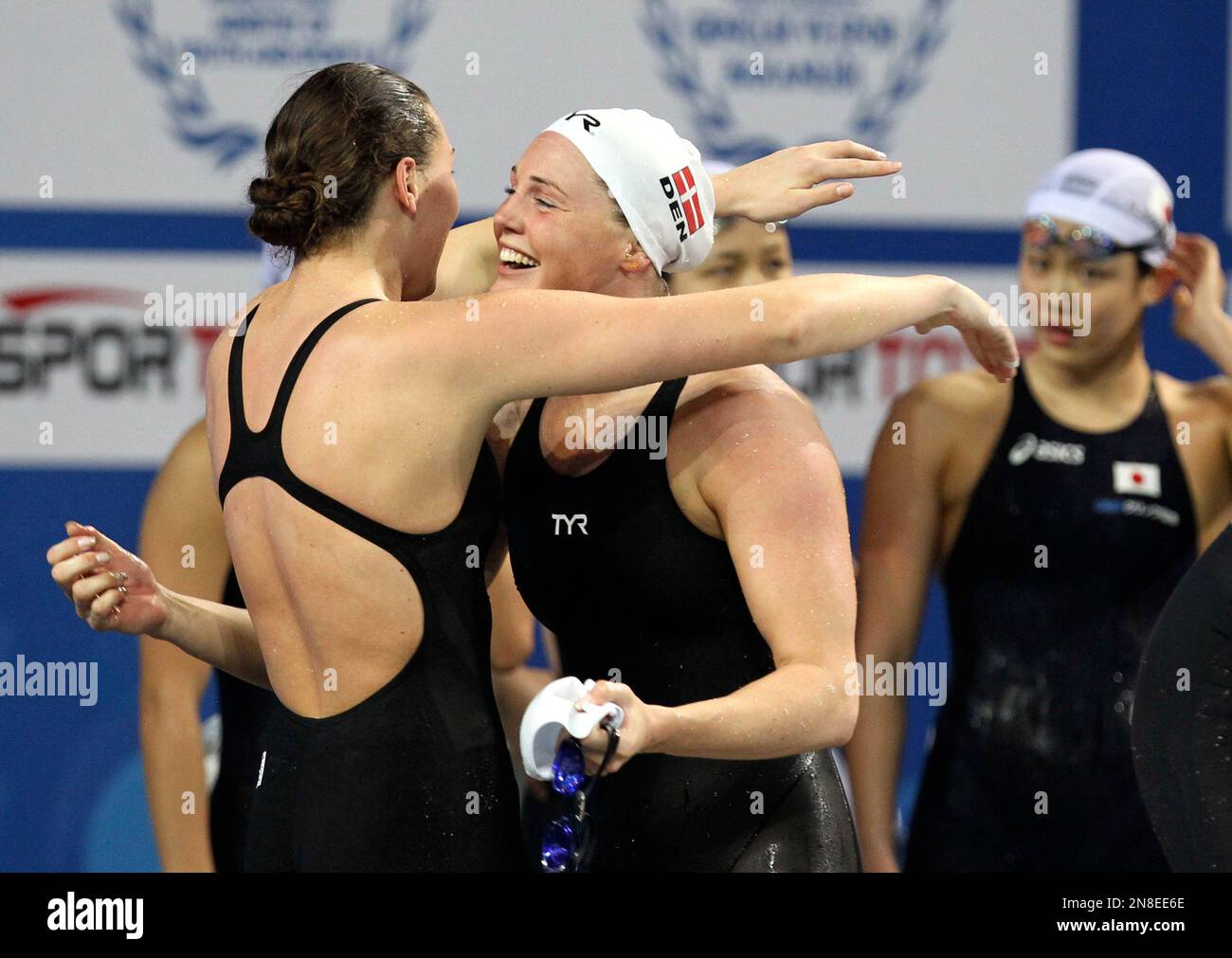 Denmark's swimmers celebrate their victory in the women's 4x100 meters ...