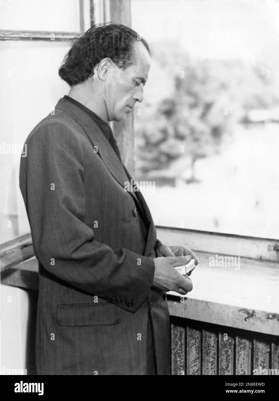 Polish-born German miracle healer Bruno Groening, stands at the window ...