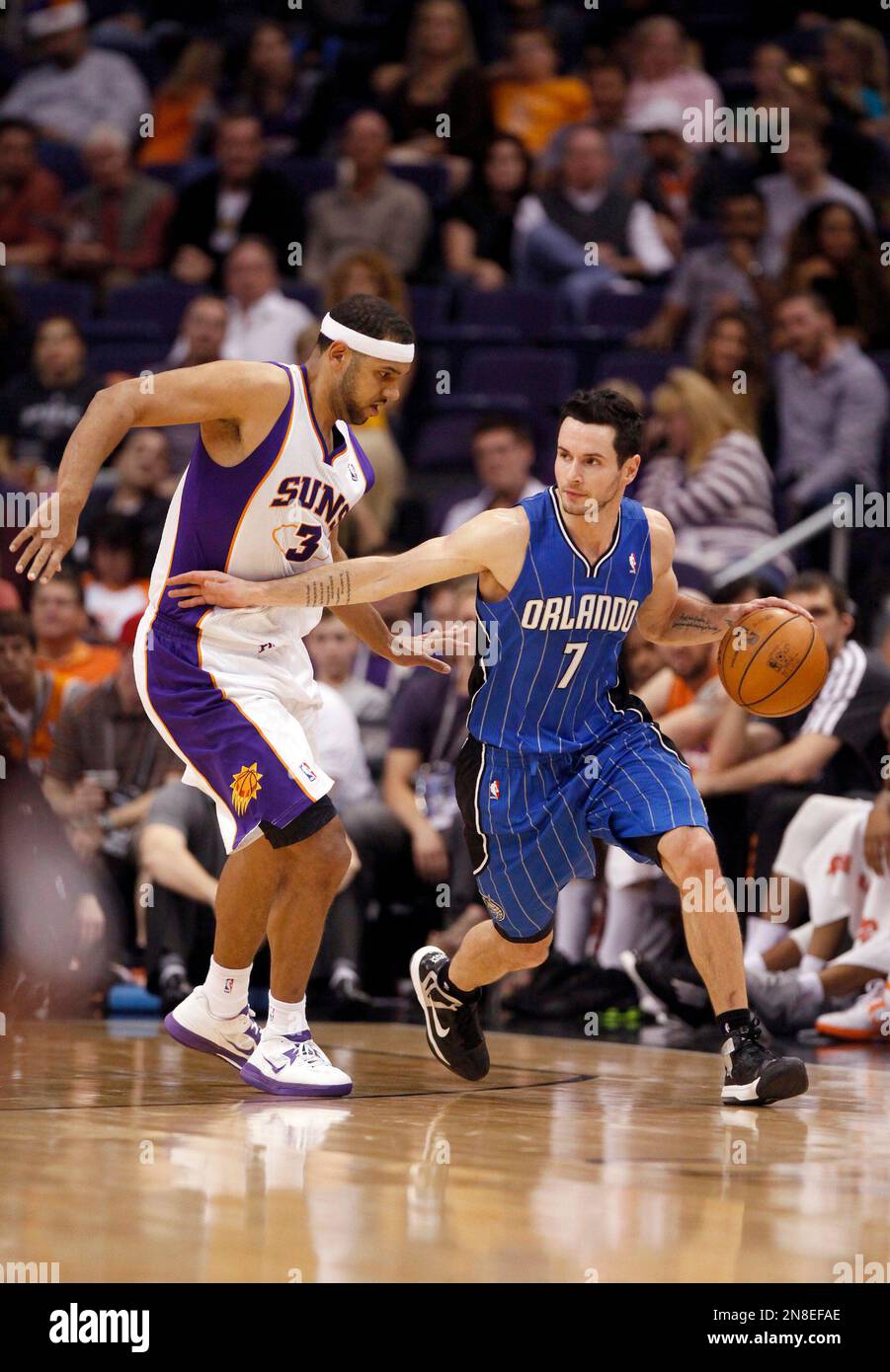 Orlando Magic's J.J. Redick, right, against Phoenix Suns' Jared Dudley ...