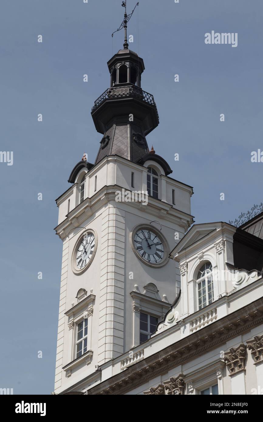 A closeup view of the clock tower of Jablonowski Palace in Warsaw Stock ...