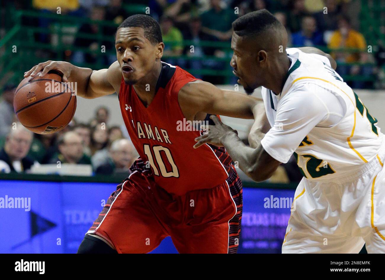 Lamar forward Rhon Mitchell (10) looks for an opening against Baylor ...