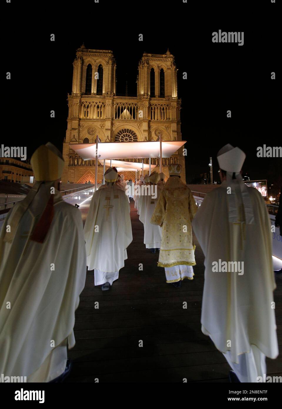 Religious dignitaries enter Paris' Notre Dame Cathedral as part of a ...
