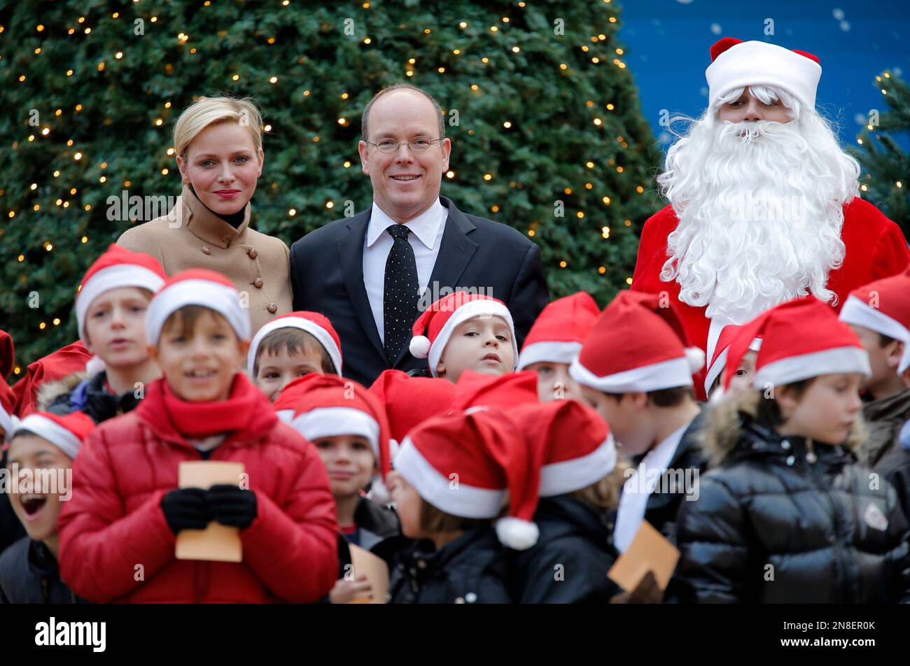 Prince Albert II of Monaco, center, with his wife Princess Charlene and ...
