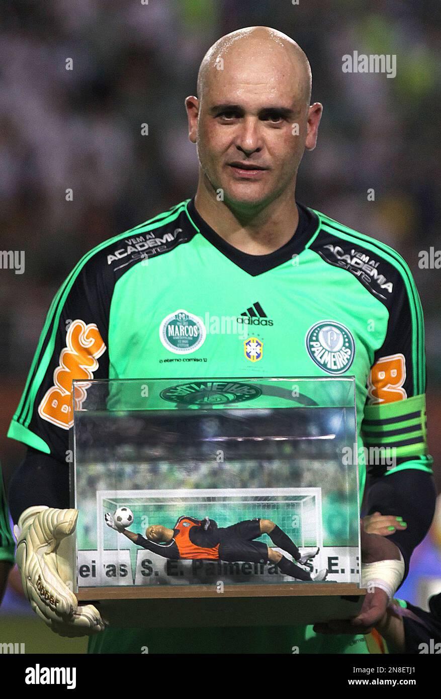 Brazil's former goalkeeper Marcos, holding a miniature depicting ...