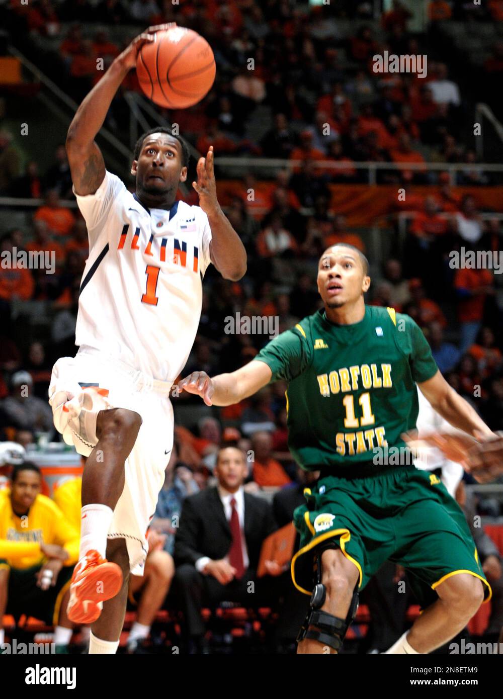 Illinois' D.J. Richardson (1) breaks to the basket ahead of Norfolk ...