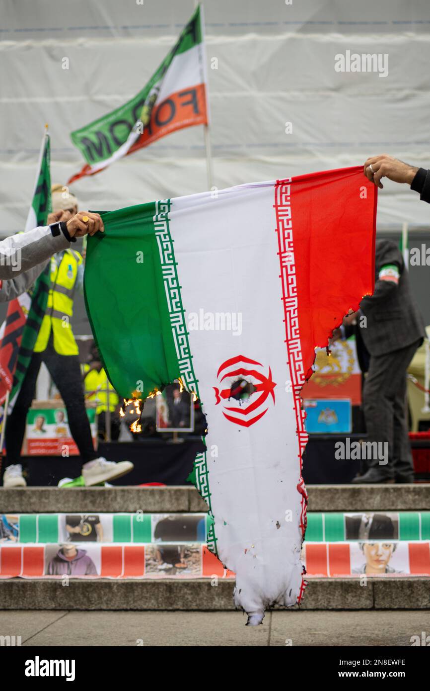London, UK - 11 Feb 2023: Protesters burning the flag of the Islamic ...