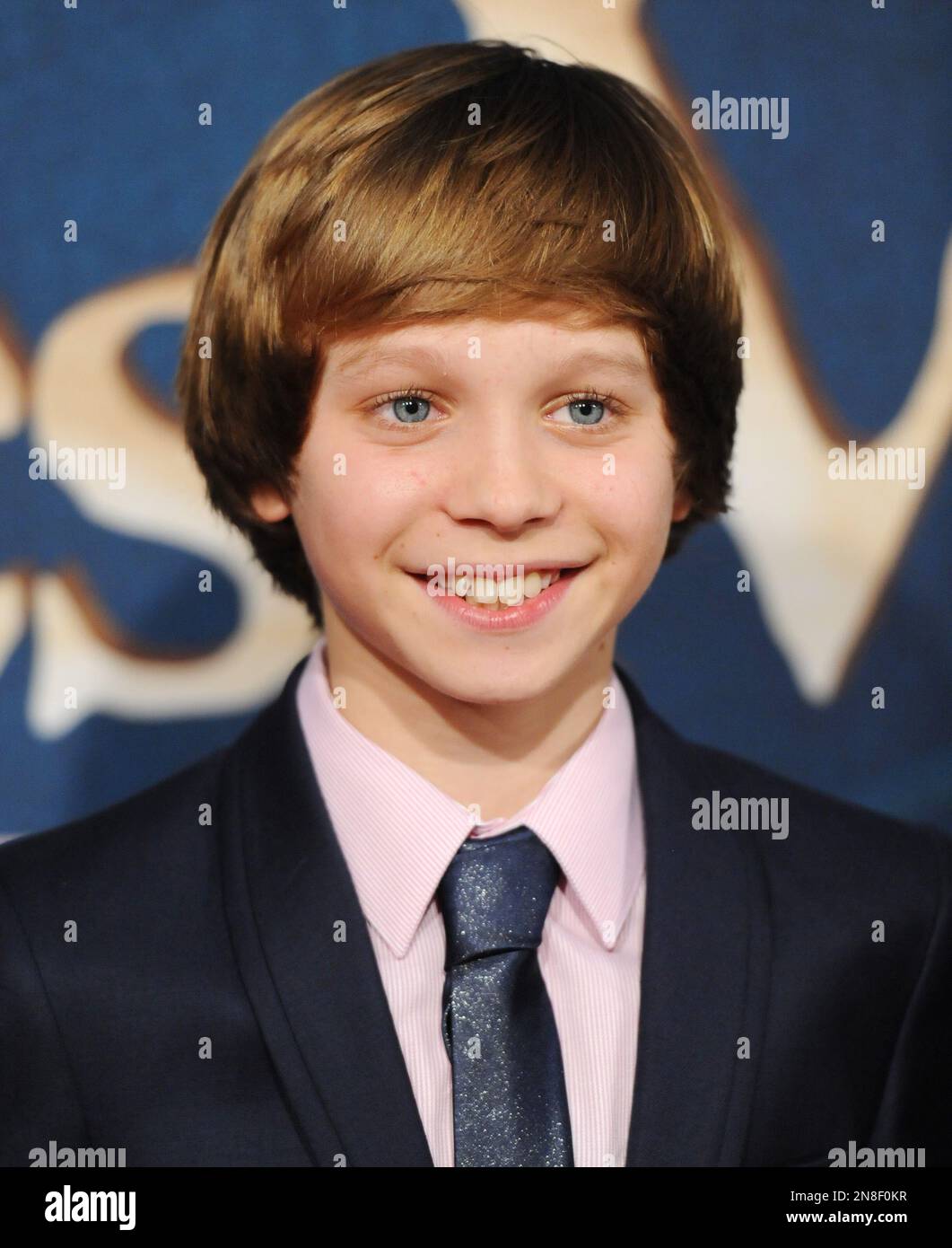 Daniel Huttlestone attends the premiere for "Les Miserables" at the ...