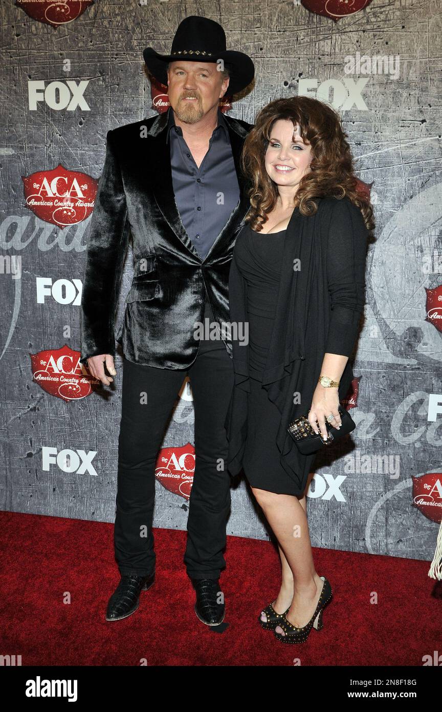 From left, co-host Trace Adkins and Rhonda Forlaw arrive at the American Country Awards on ...