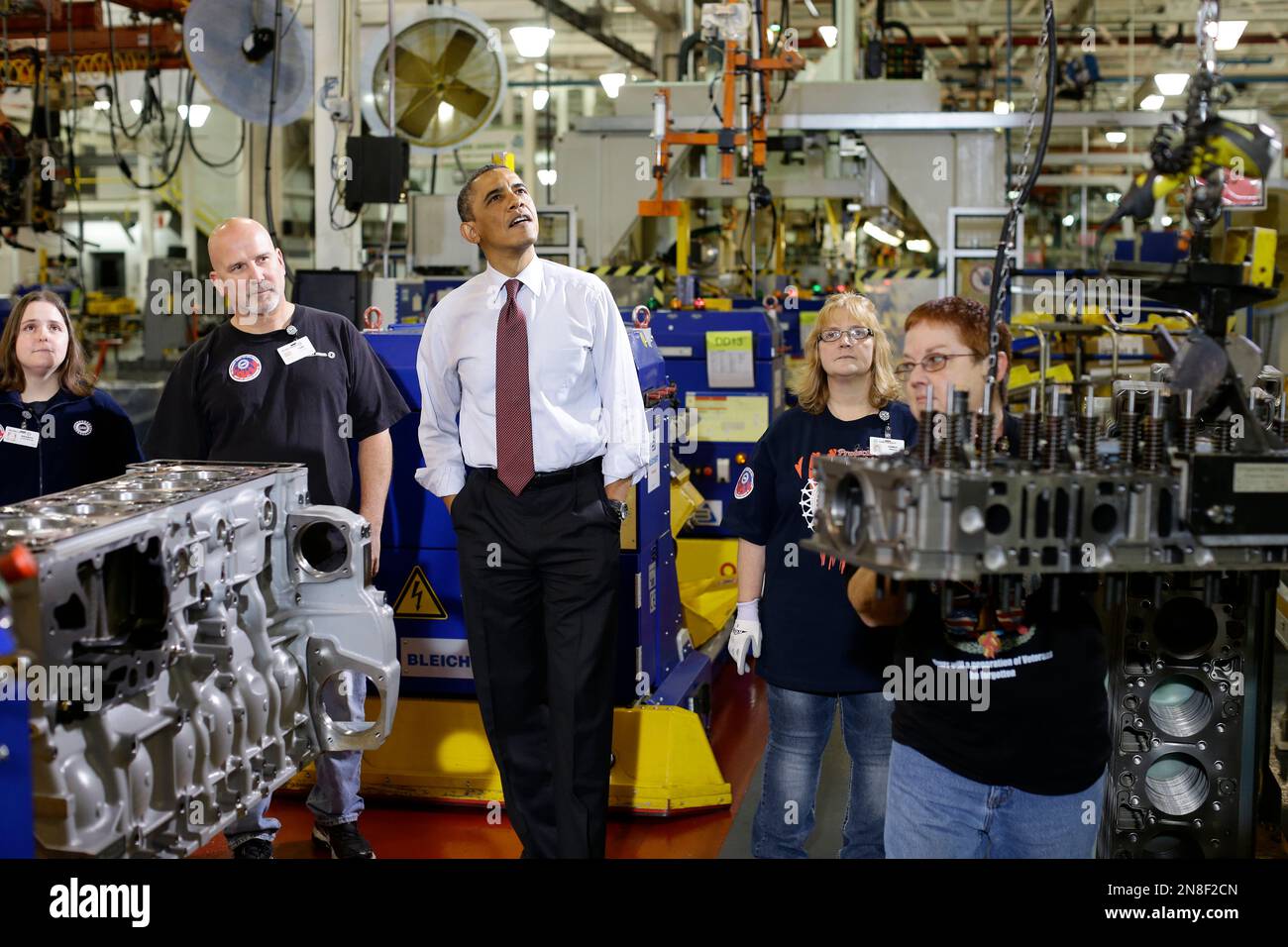 President Barack Obama watches workers during a visit to the heavy duty ...