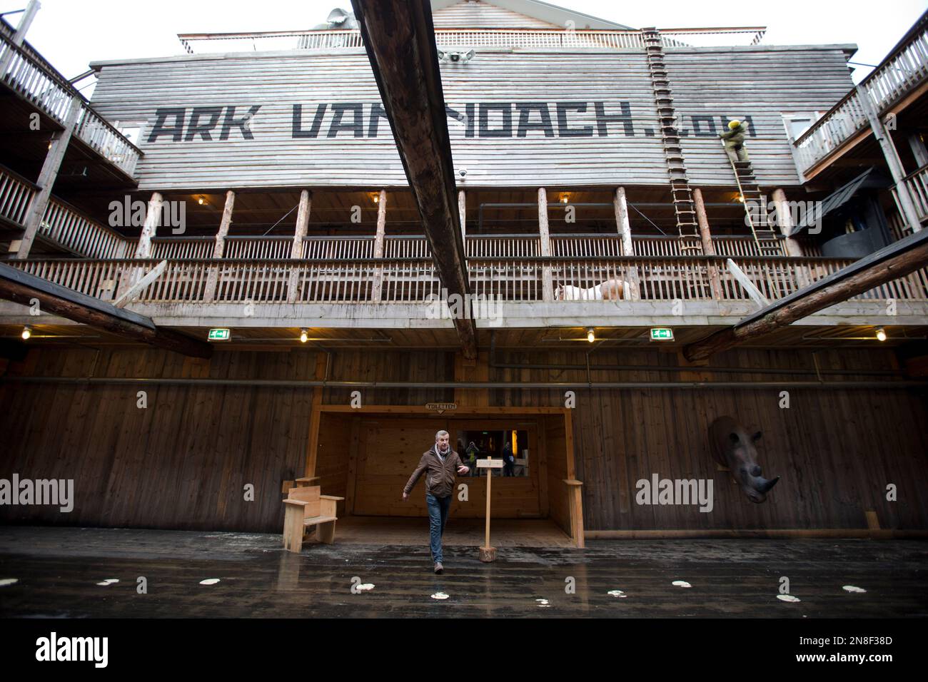 Johan Huibers, center, shows journalists the inside of the full scale ...