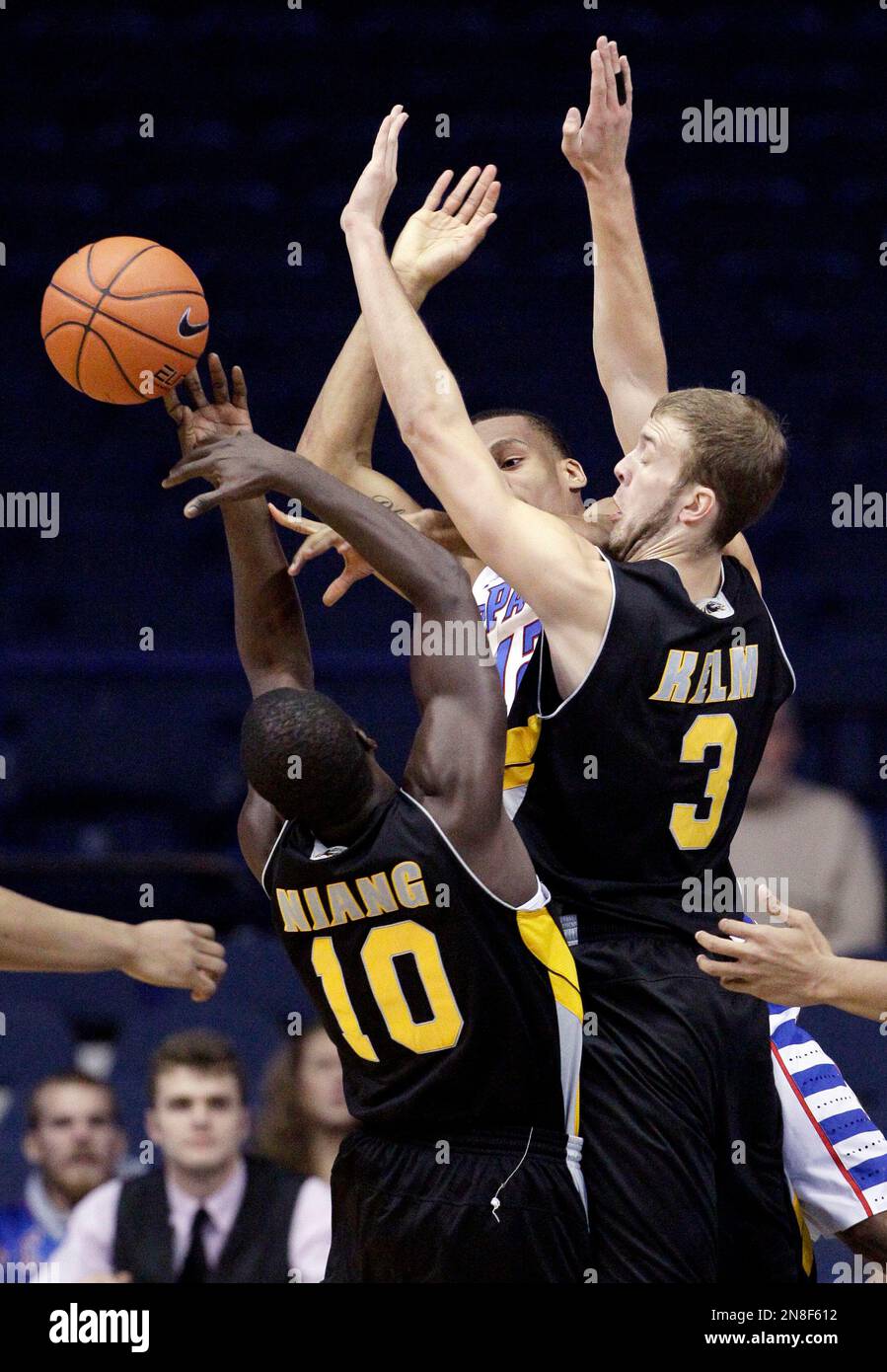 DePaul forward Cleveland Melvin, center, passes the ball against ...