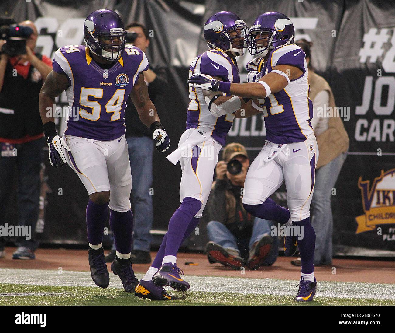 Minnesota Vikings' Josh Robinson, right, celebrates his touchdown ...