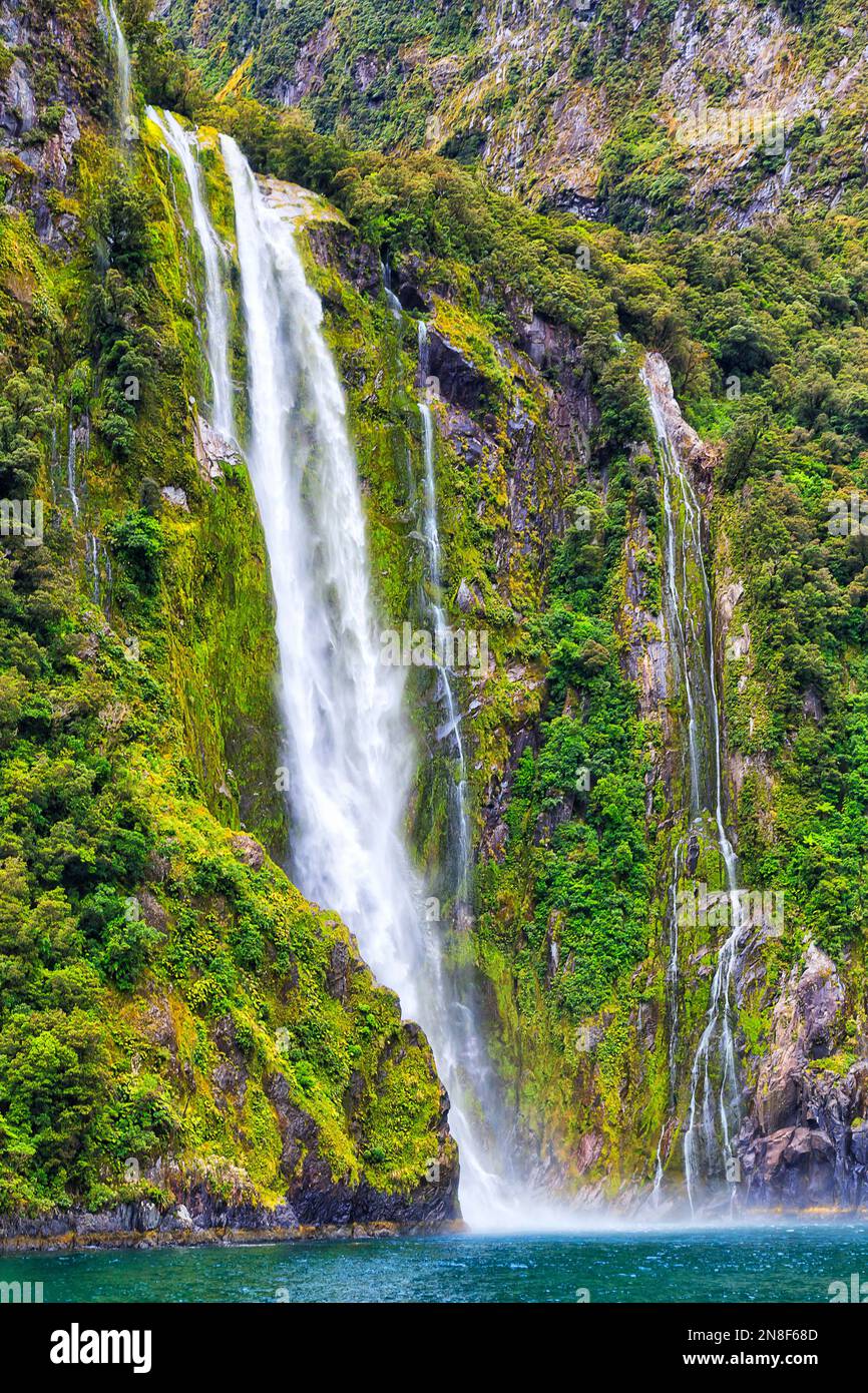 Stirling falls in Hanging valley of MIlford Sound fiordland, New Zealand - scenic tourism cruise ...