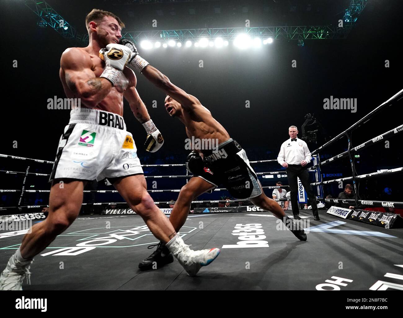 Tyler Denny (right) strikes Brad Pauls in the English Middleweight ...