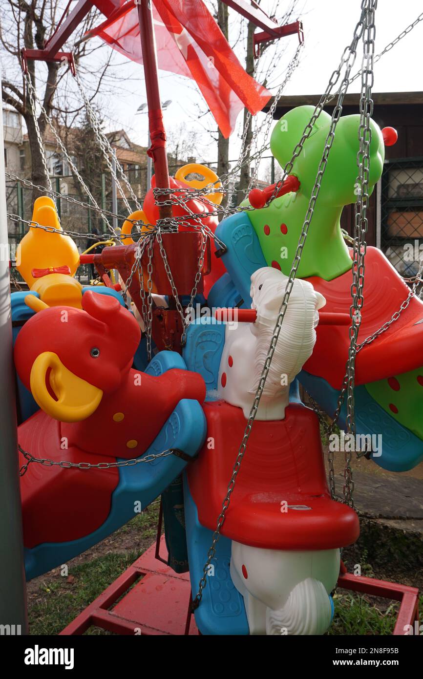 colorful plastic kids carousel toy, chained up, not used Stock Photo ...