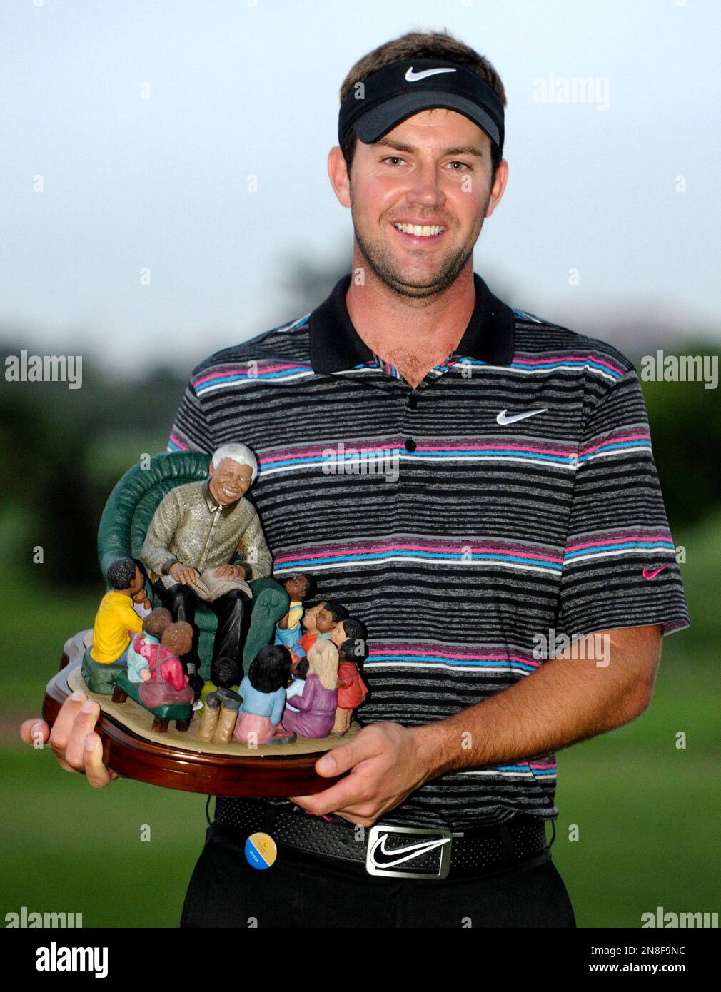 Scotland's Scott Jamieson holds the trophy after winning the inaugural ...
