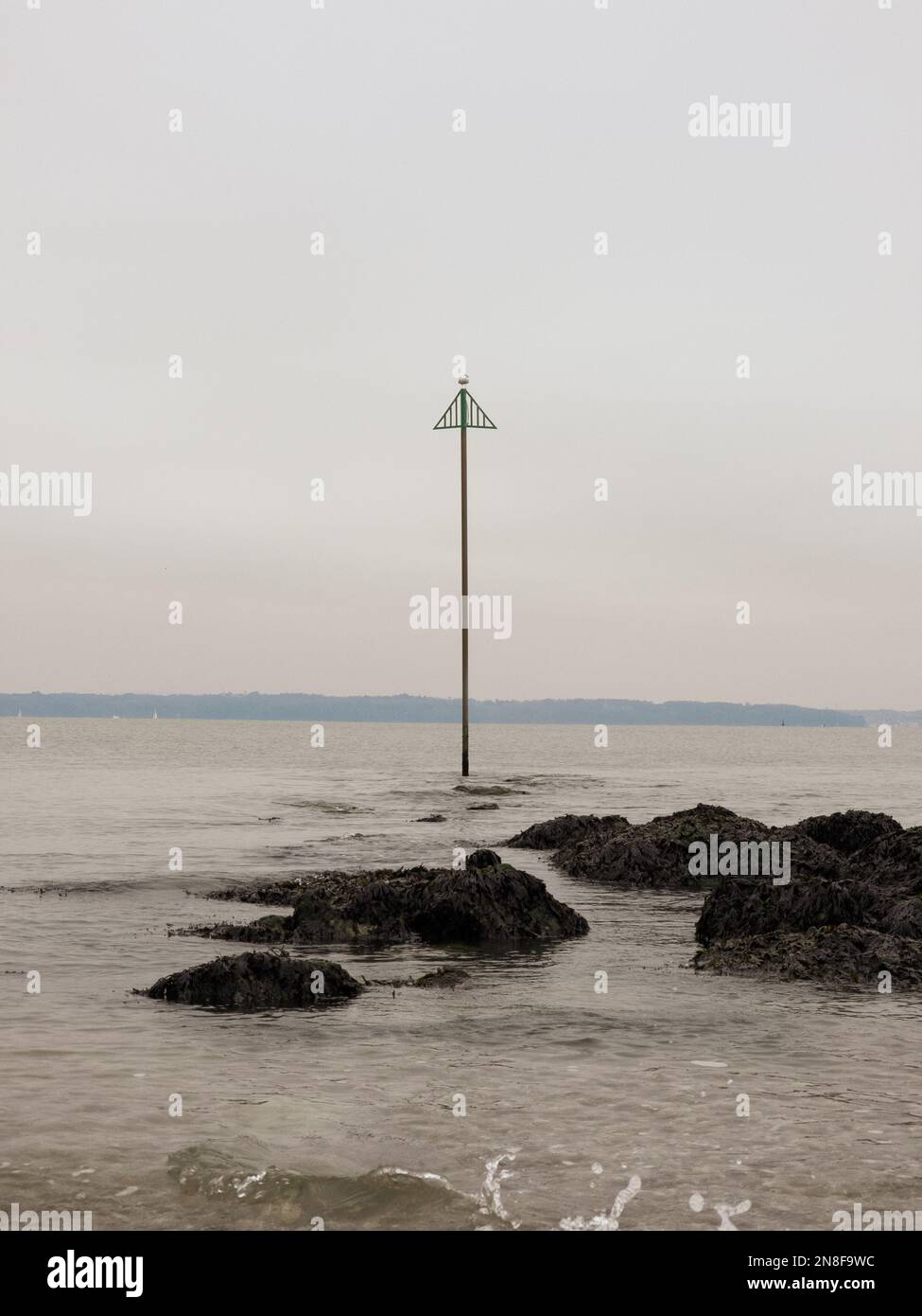A vertical shot of Lee-on-the-solent beach with the Isle of Wight in ...