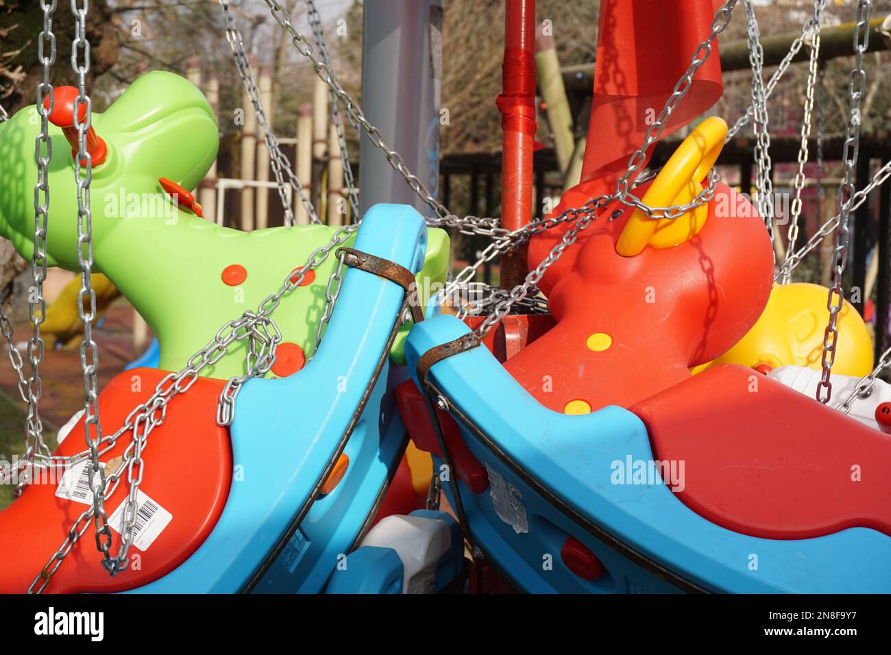 colorful plastic kids carousel toy, chained up, not used Stock Photo ...