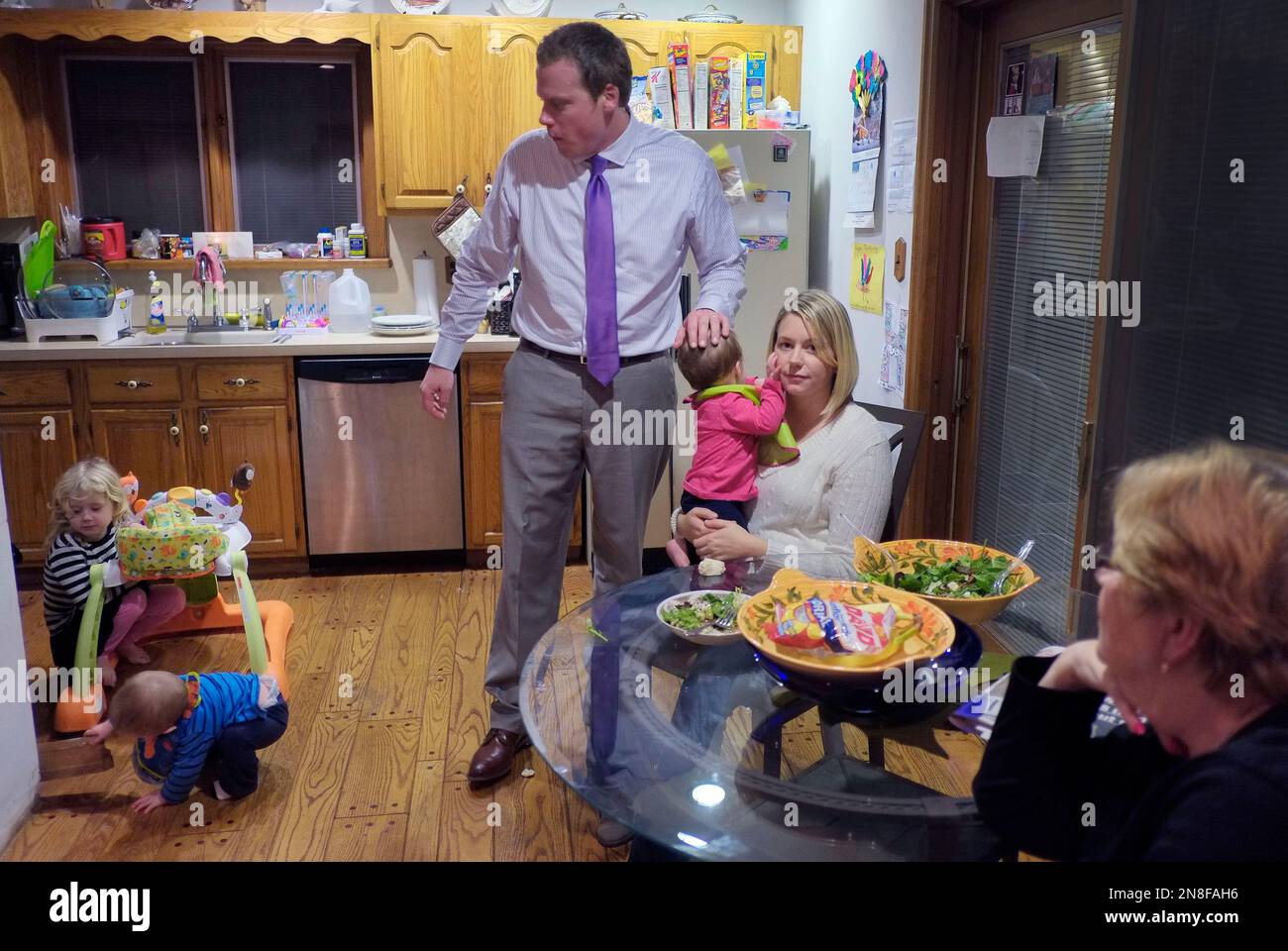 In this Tuesday, Dec. 4, 2012 photo, Pat Mullaney, center, and his wife ...