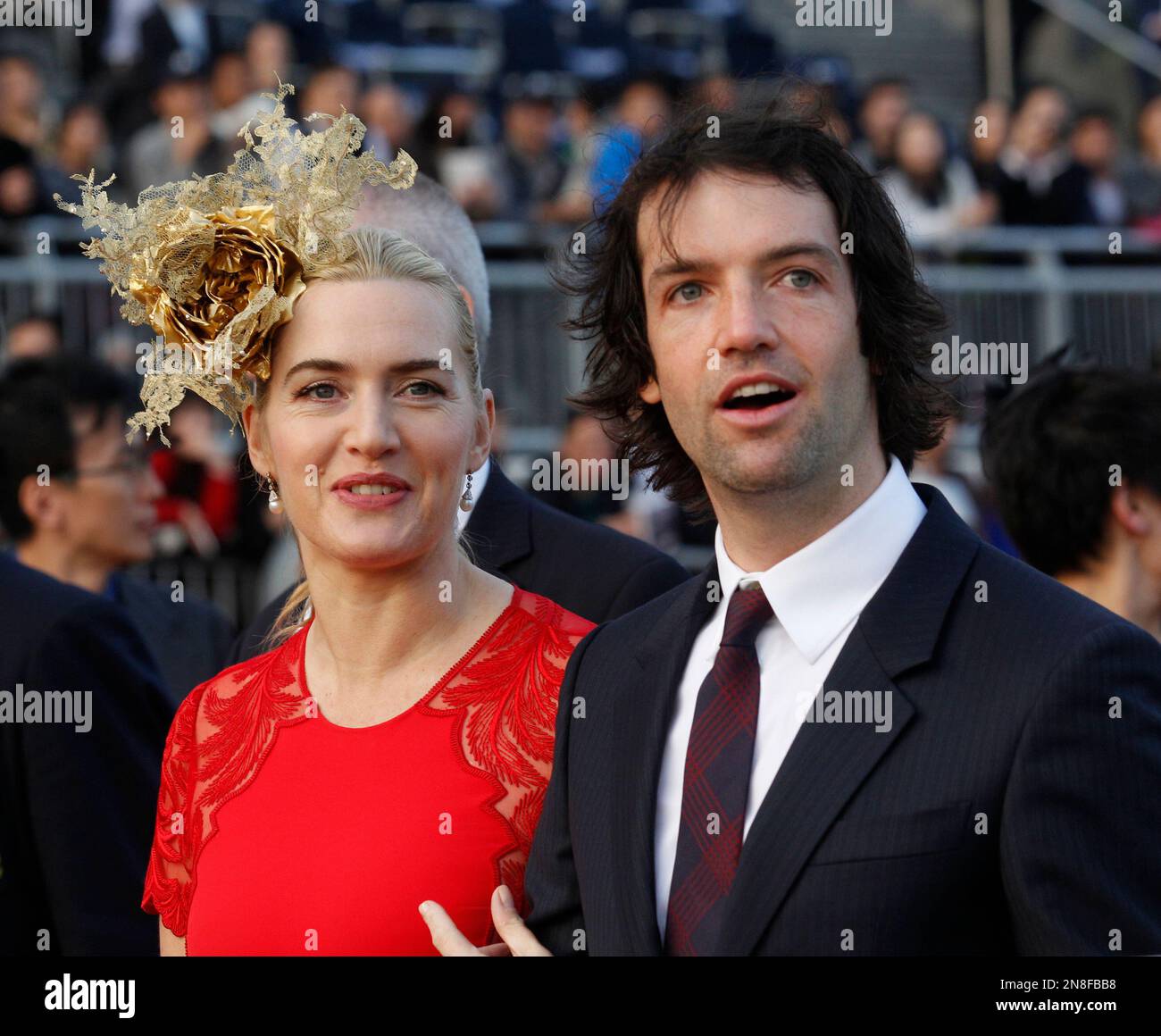 British actress Kate Winslet, left, arrives with her boyfriend Ned ...
