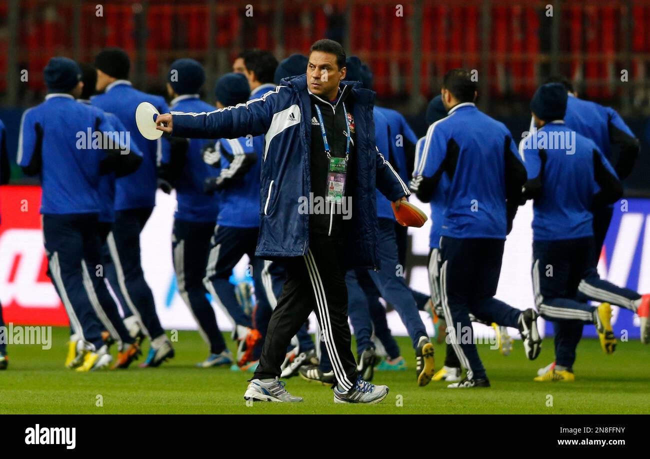 Al-Ahly SC's coach Hossam El Badry walks past his players during the ...