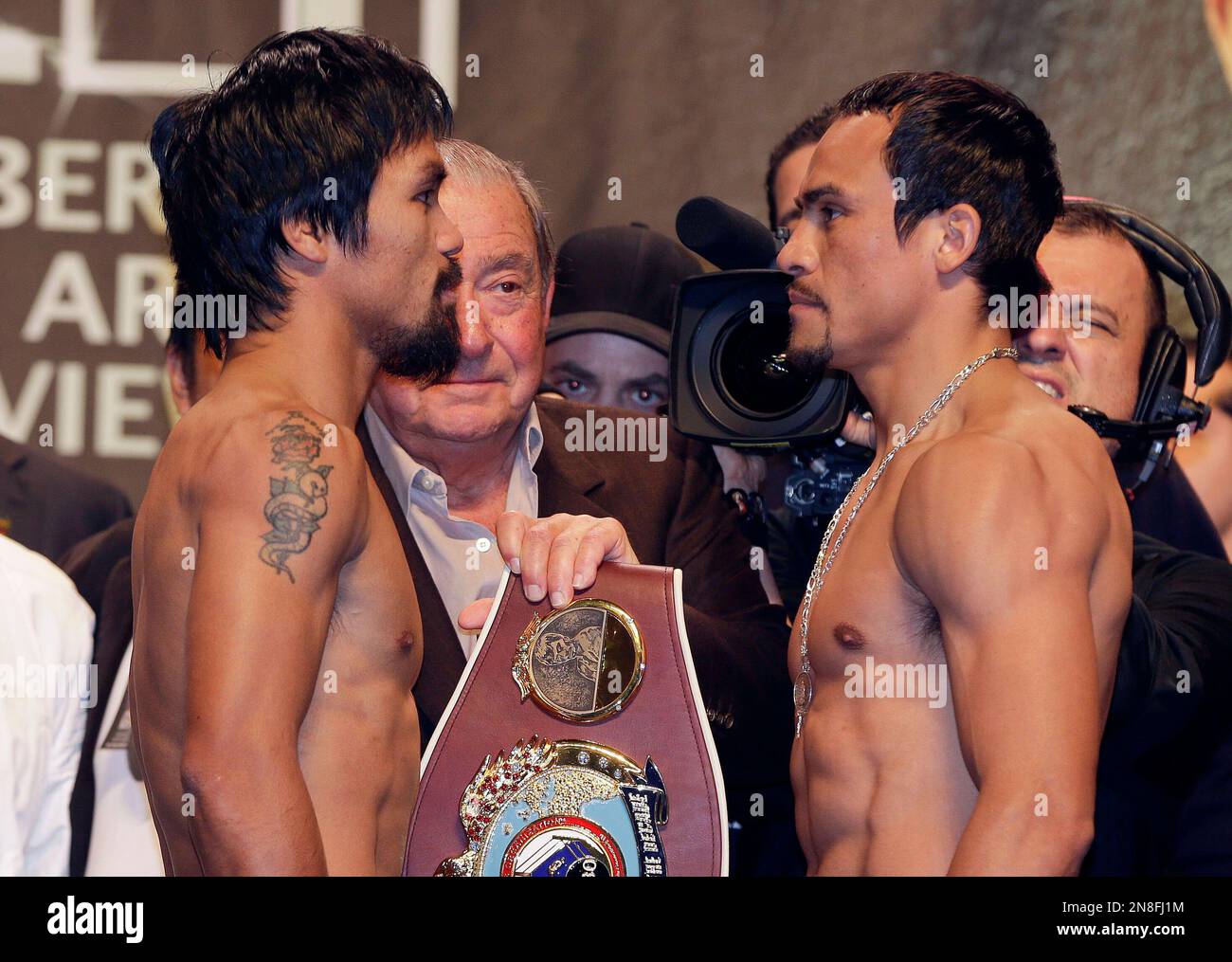 Manny Pacquiao, left, and Juan Manuel Marquez pose for photos after the ...