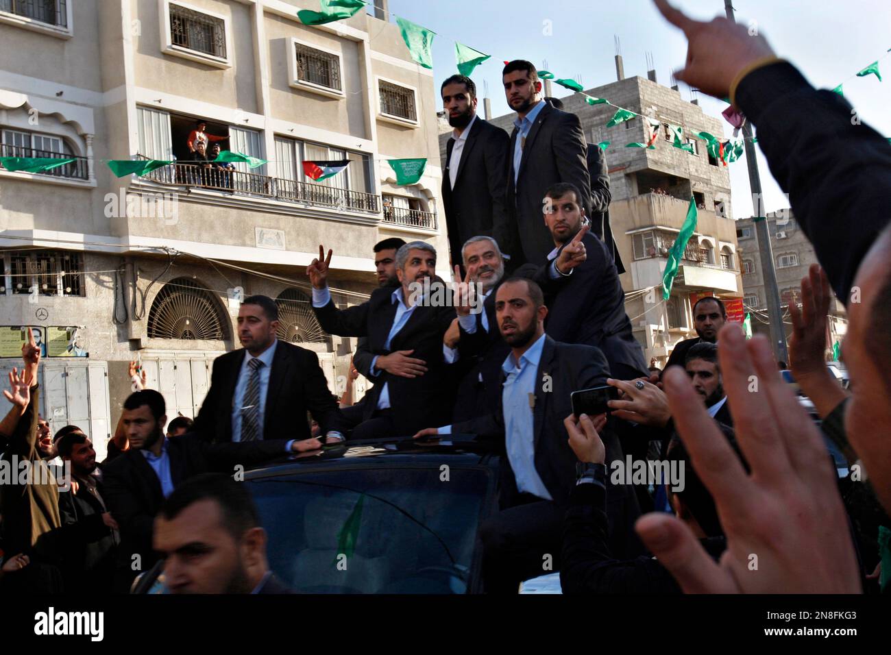 Hamas leader Khaled Mashaal, center left, and Hamas Prime Minister ...