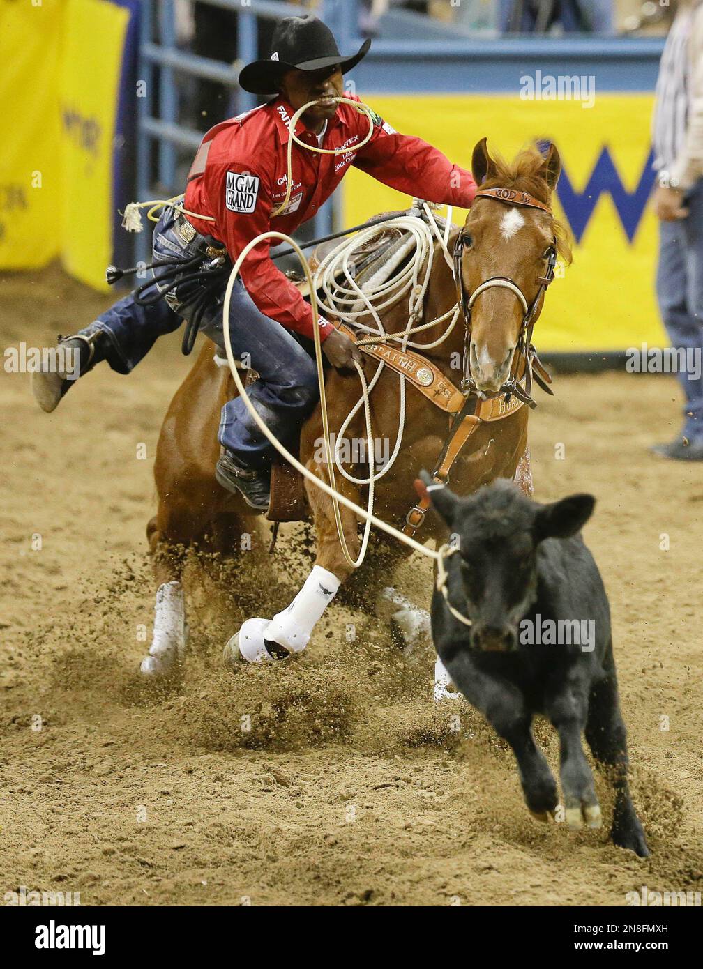 Cory Solomon of Prairie View, Texas comes off his horse in the tie-down ...
