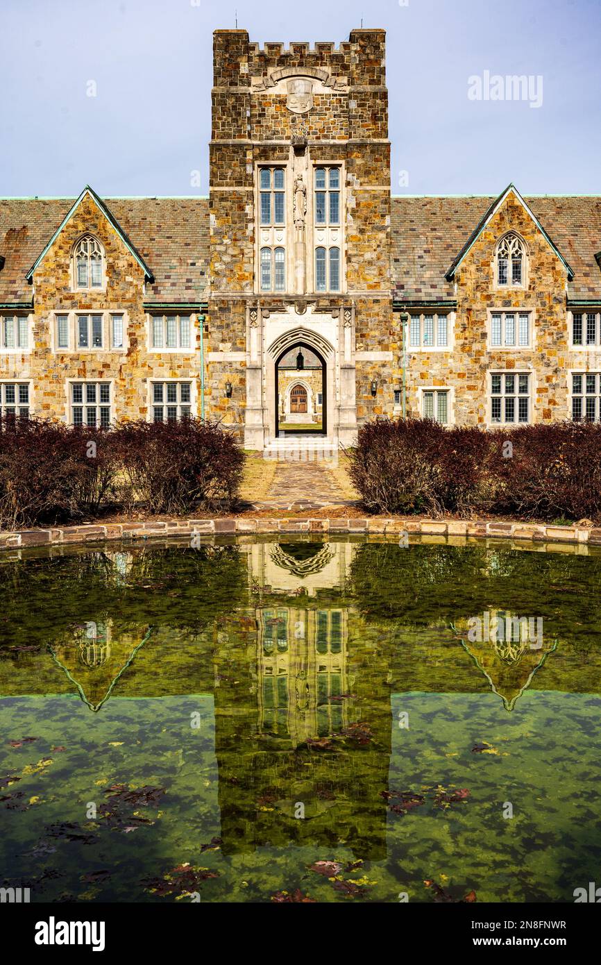 The facade of Mary Hall at Berry College with reflection on the water ...