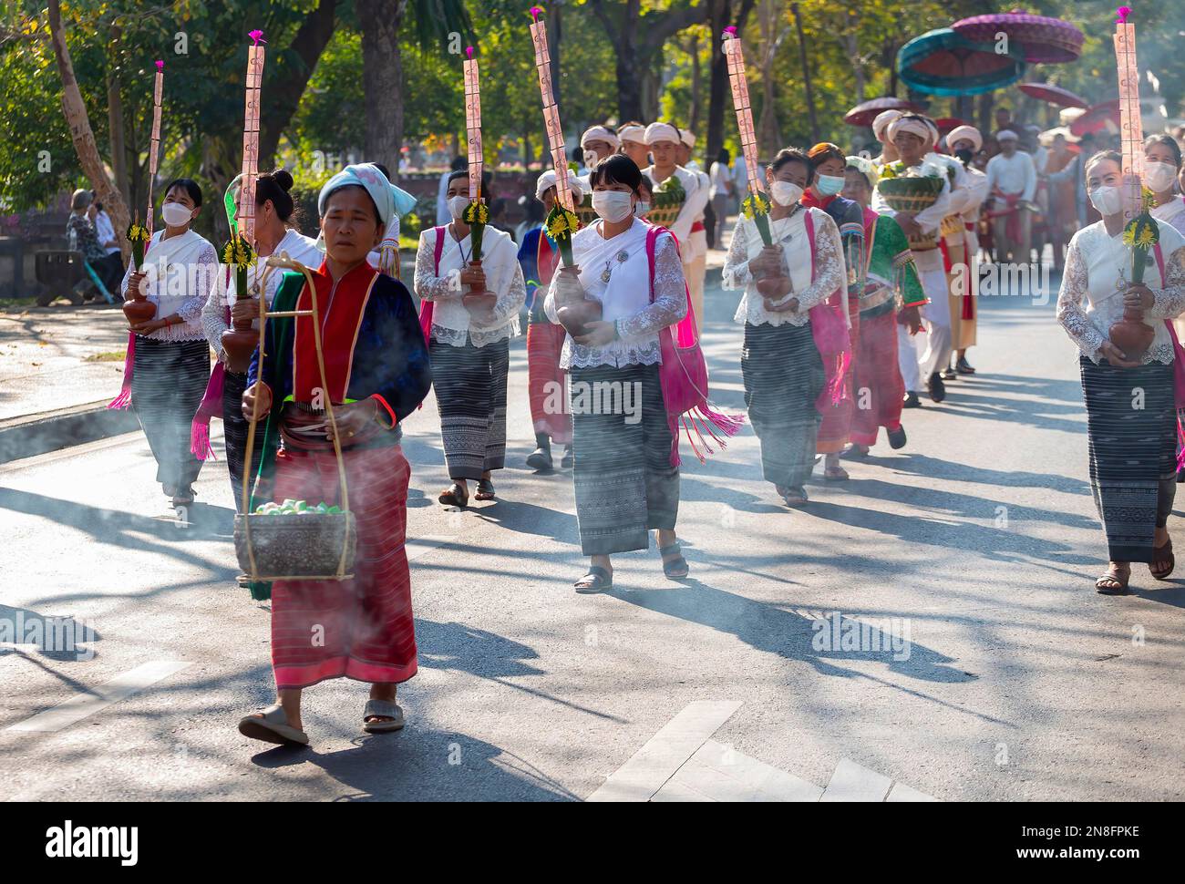 People dressed in traditional costumes during the funeral parade of ...