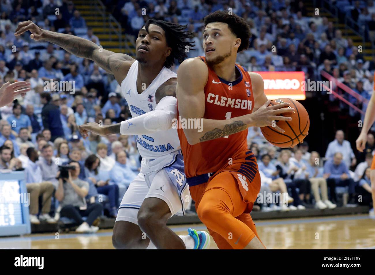 Clemson guard Chase Hunter drives against North Carolina guard Caleb ...