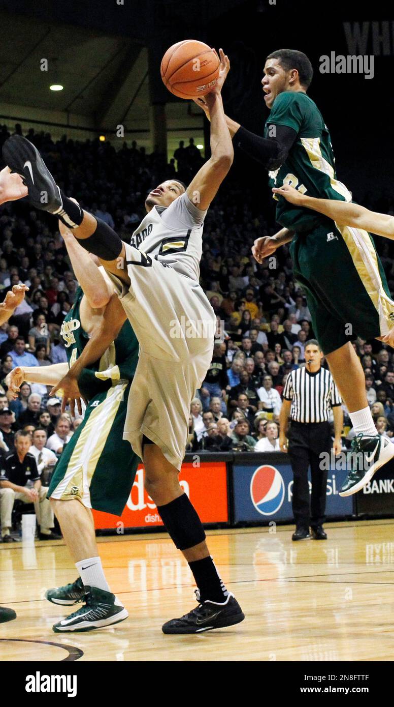 Colorado guard Andre Roberson, left, struggles to pull in a rebound as ...