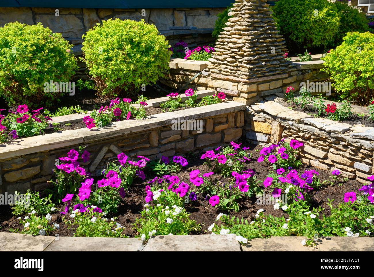 Landscape design of home garden, landscaping with flowers and stone ...