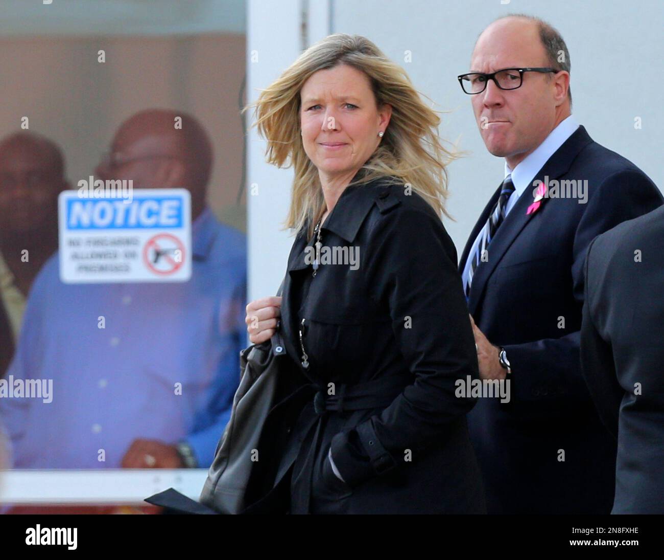 Kansas City Chiefs General Manager Scott Pioli, right, leaves a ...