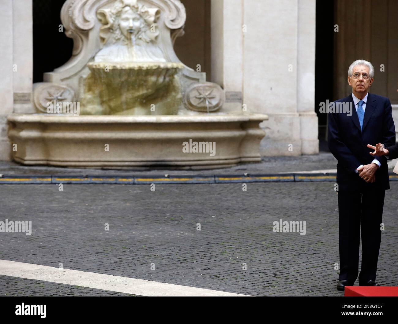 Italian Premier Mario Monti waits for the arrival of his Lebanese ...
