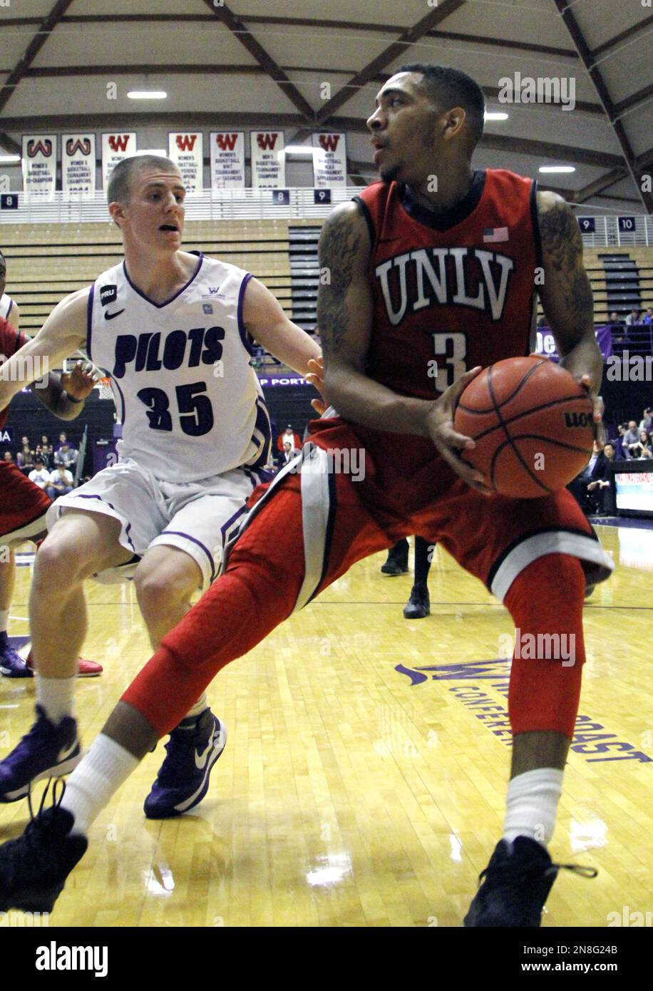 UNLV guard Anthony Marshall, right, looks for a opening against ...