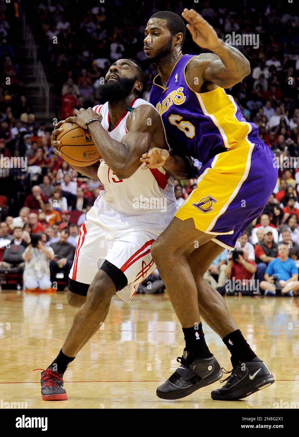 Houston Rockets' James Harden (13) is fouled by Los Angeles Lakers ...